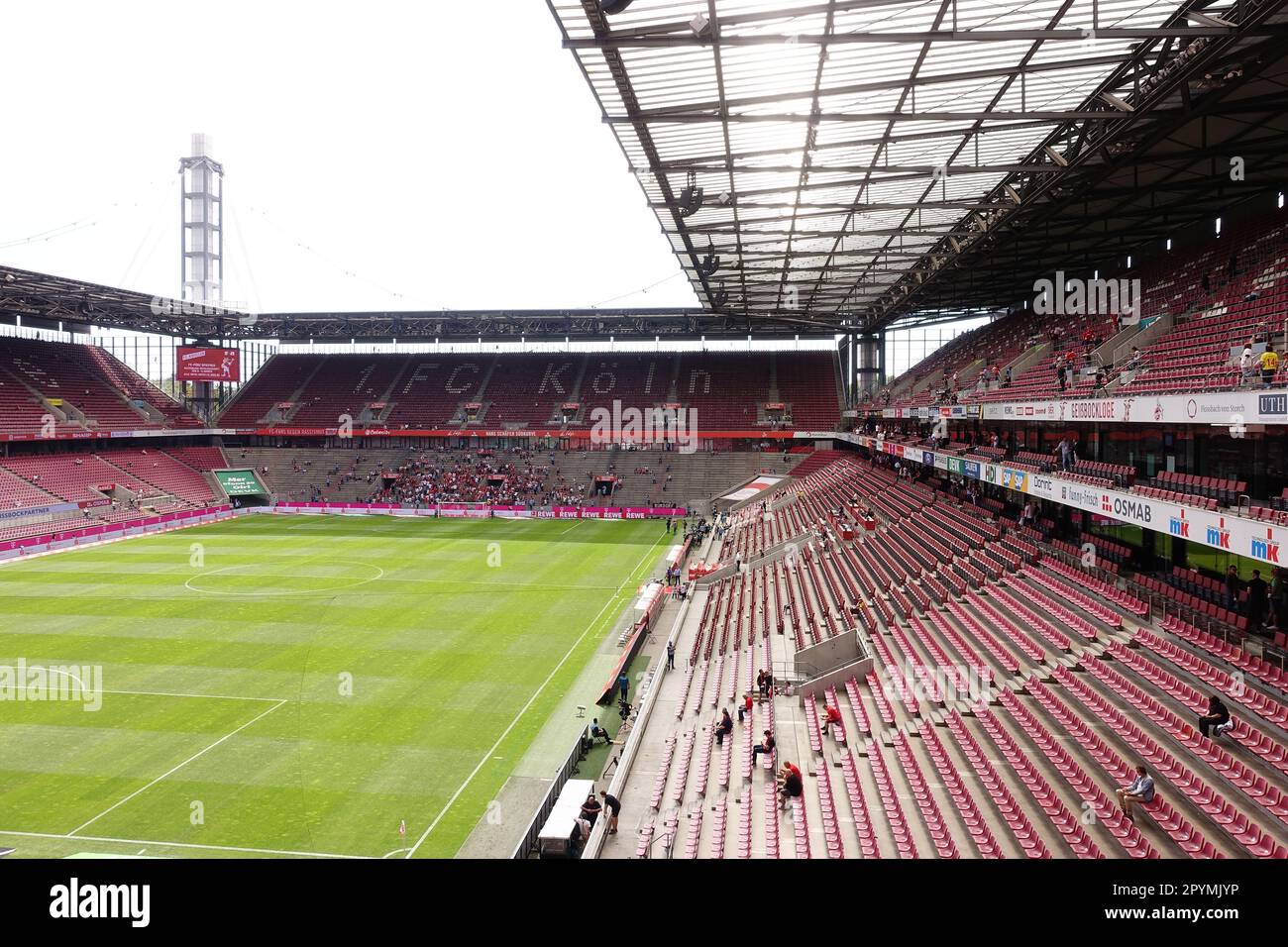 An expansive stadium filled with a large crowd of people watching a ...