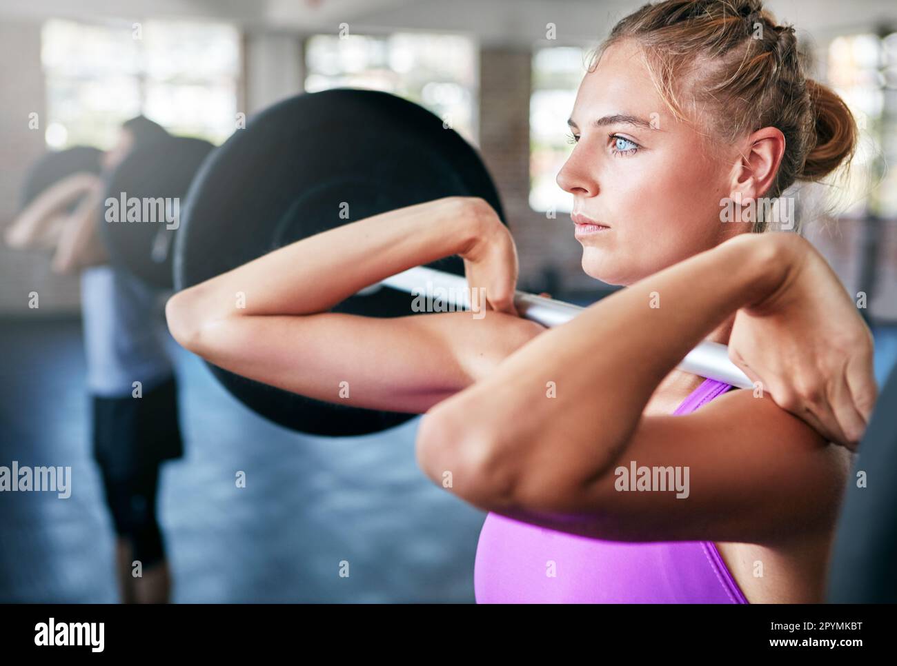 You cant go wrong with strong. a young woman working out with weights ...