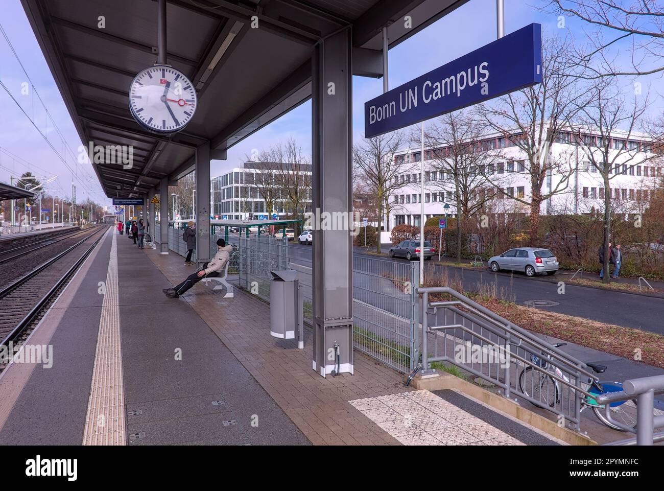 This is a photograph of Bonn UN Campus train station, featuring a clock ...