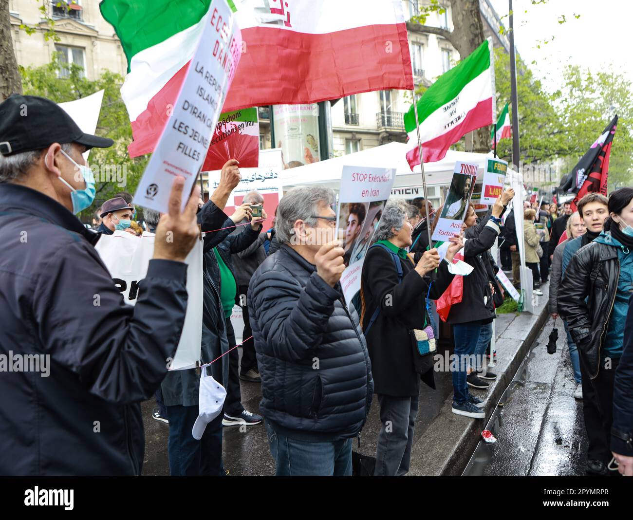 Iranians in Paris join the rally with flags and pictures of victims in ...