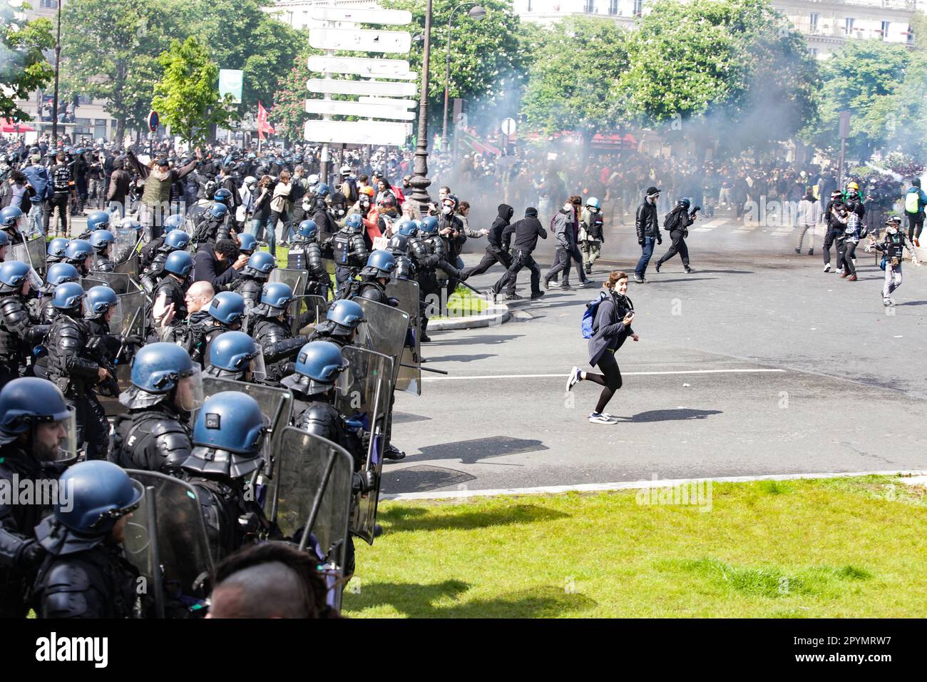 French police forces clash with demonstrators in the Nation Square as police uses tear gas to ...