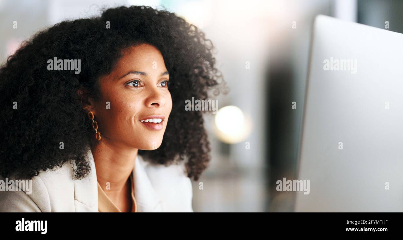 Female IT Manager working on a desktop computer. Happy Information ...
