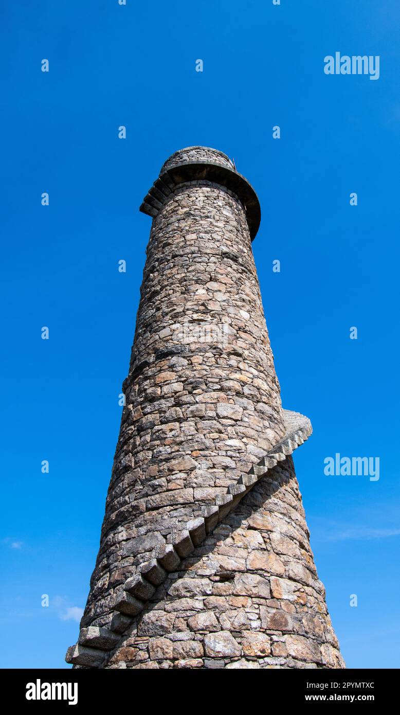 A low-angle shot of Ballycorus Flue Chimney against the background of a ...