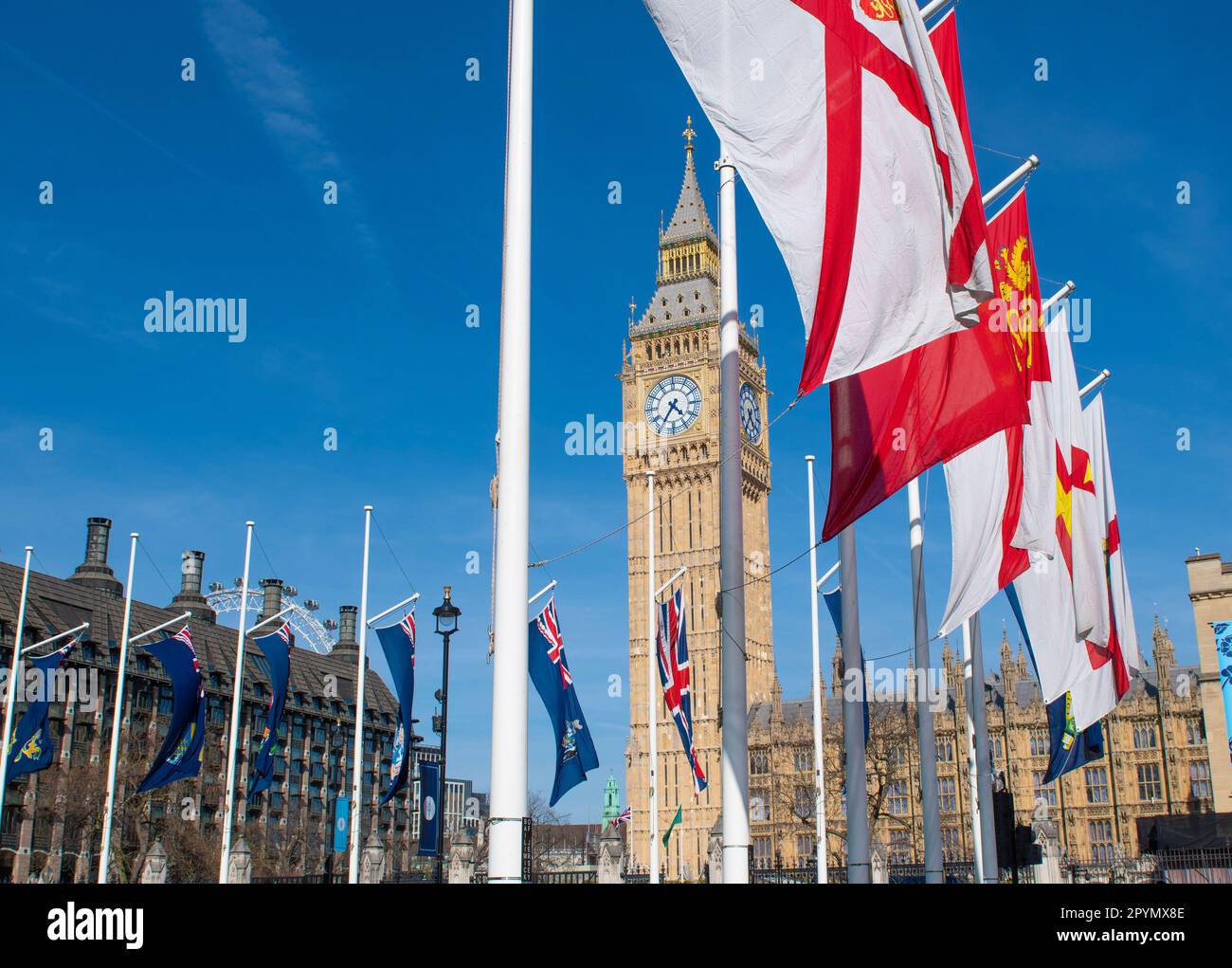London UK May 3 2023 London's Parliament Square flags fluttering in the ...