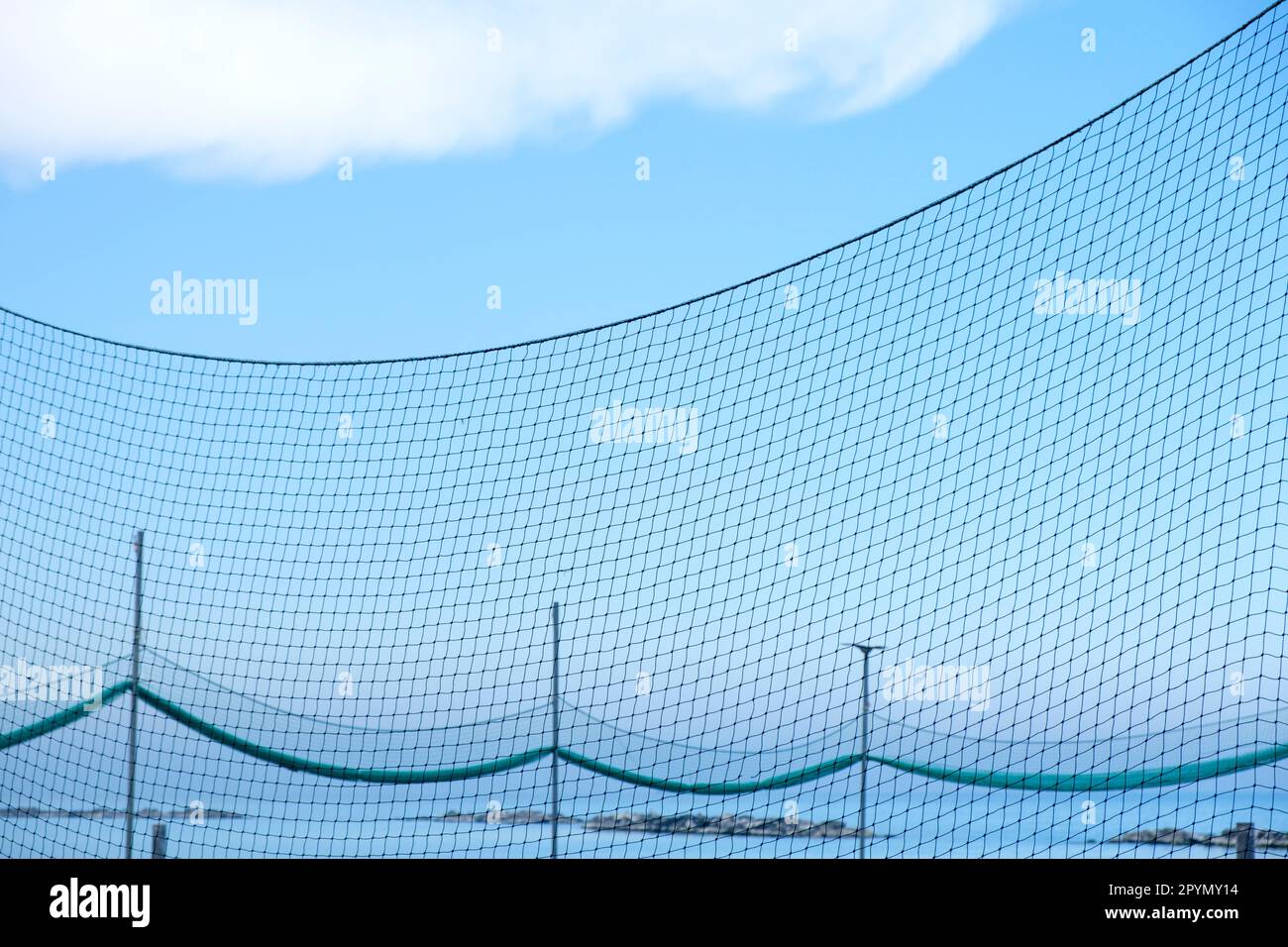 Large nets hanging from poles in an Italian seaside resort Stock Photo ...