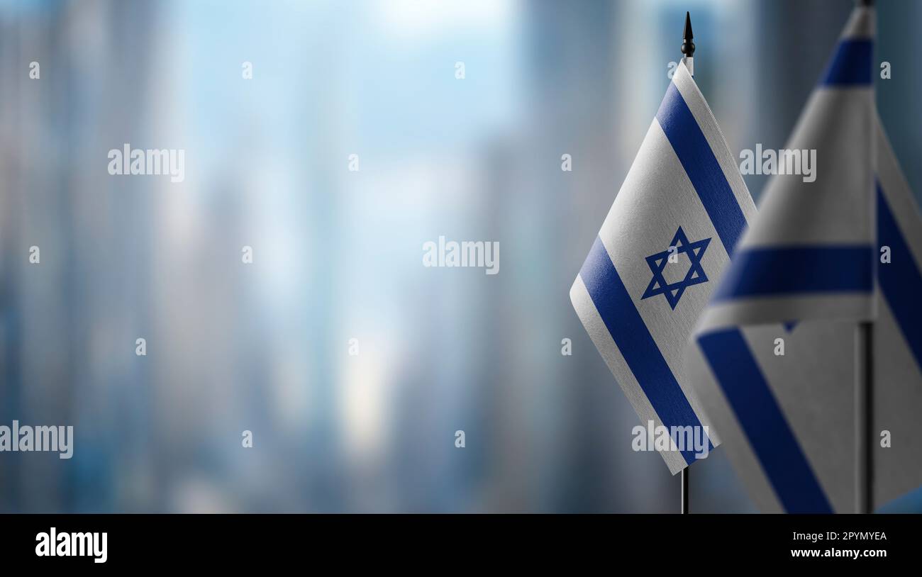 Small flags of the Israel on an abstract blurry background Stock Photo ...