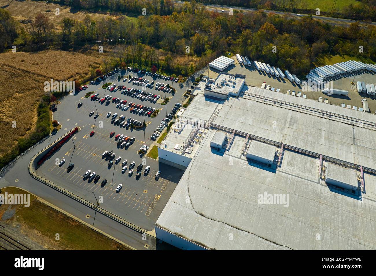 Aerial view of many employee cars parked on parking lot in front of ...