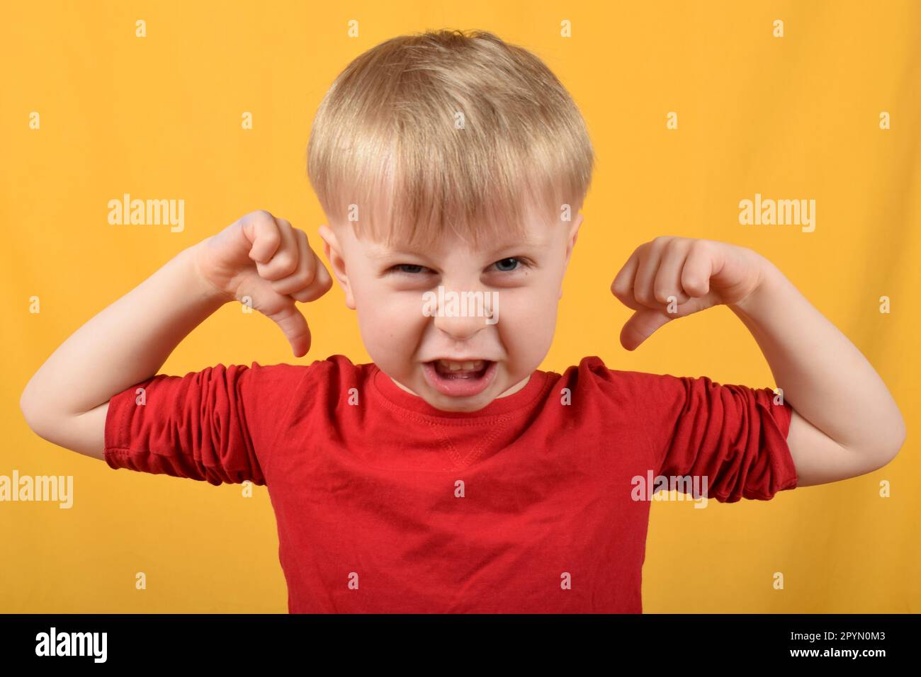 funny boy child shows his muscles Stock Photo - Alamy