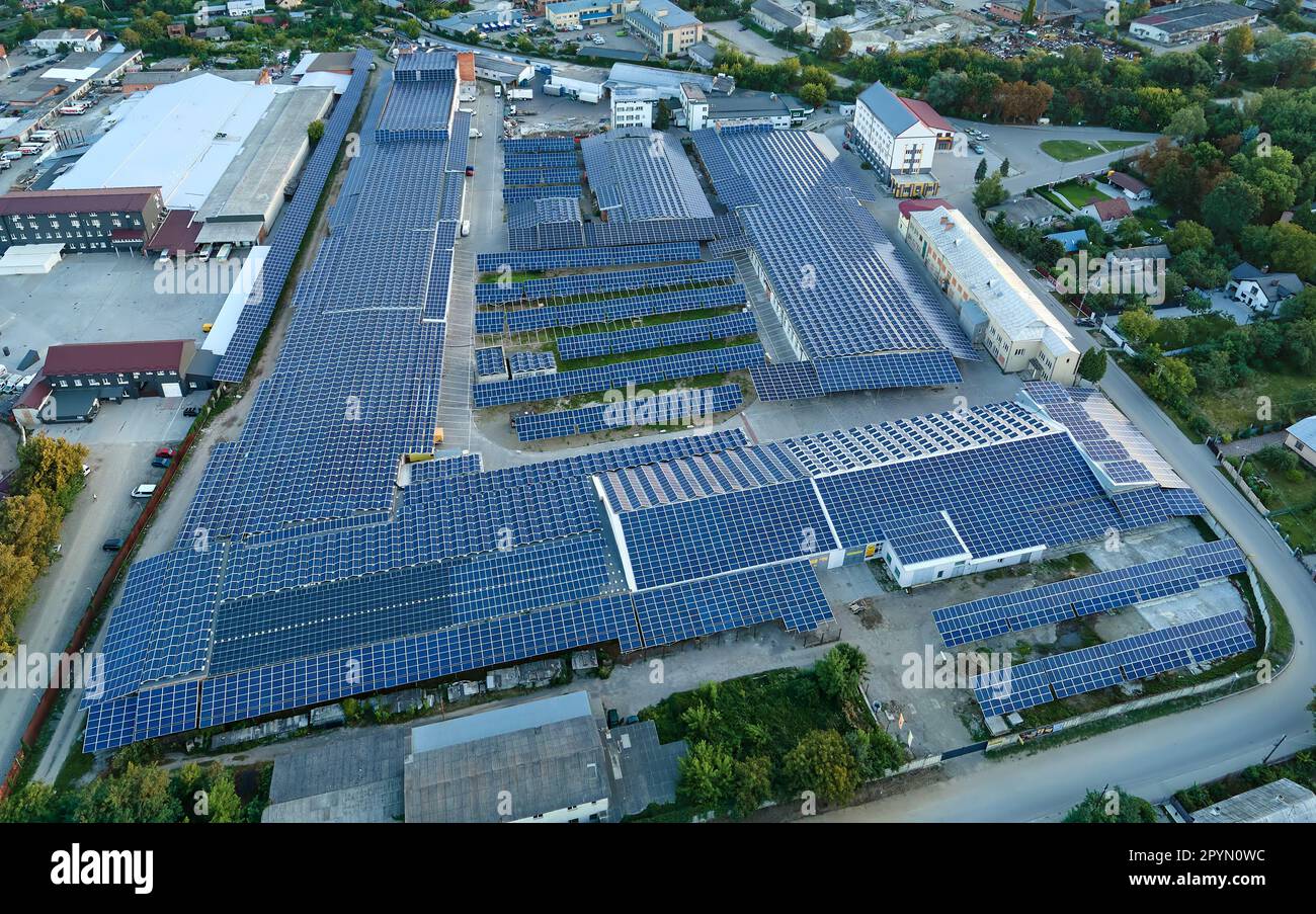 Aerial view of solar power plant with blue photovoltaic panels mounted ...