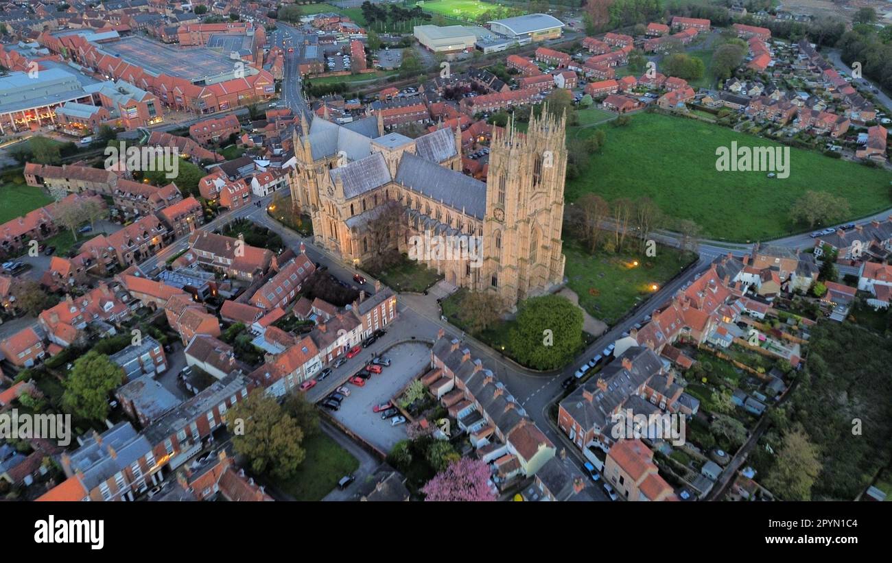 Aerial view of a grand cathedral at night, overlooking a sprawling ...