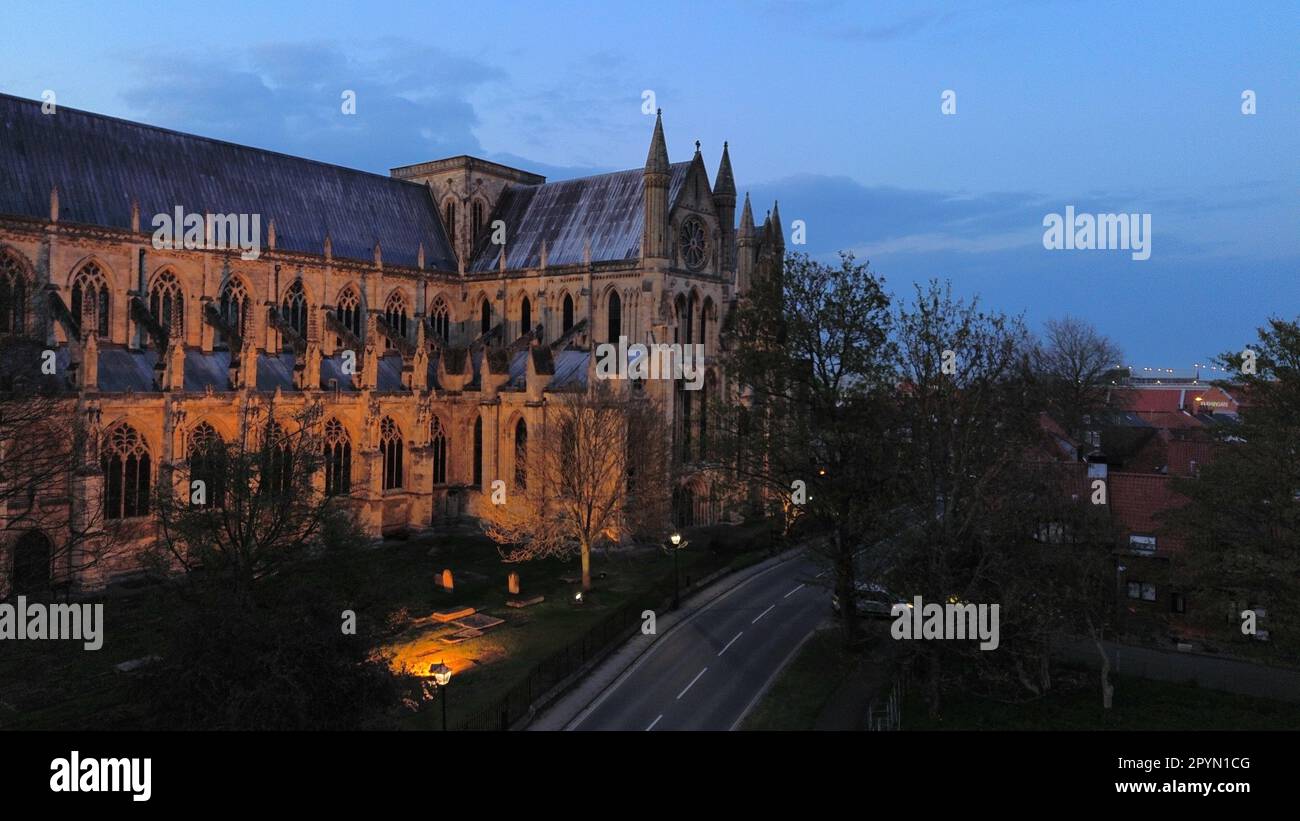 A majestic tall church stands proudly in the center of a lush green ...