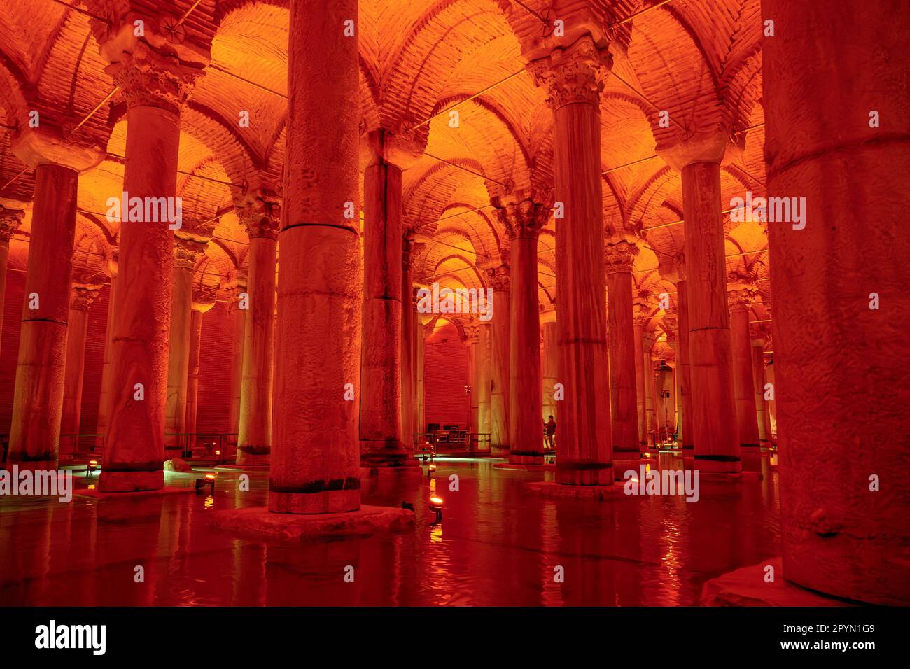 A vibrant orange light illuminates Zisterne in Istanbul, creating an ...
