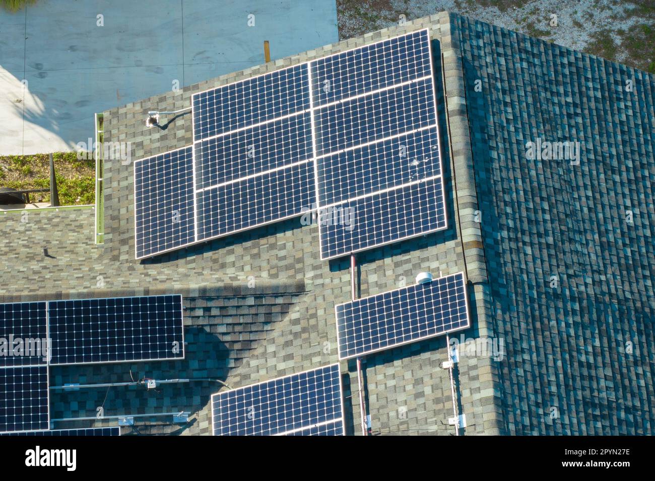 American residential house with rooftop covered with solar photovoltaic ...