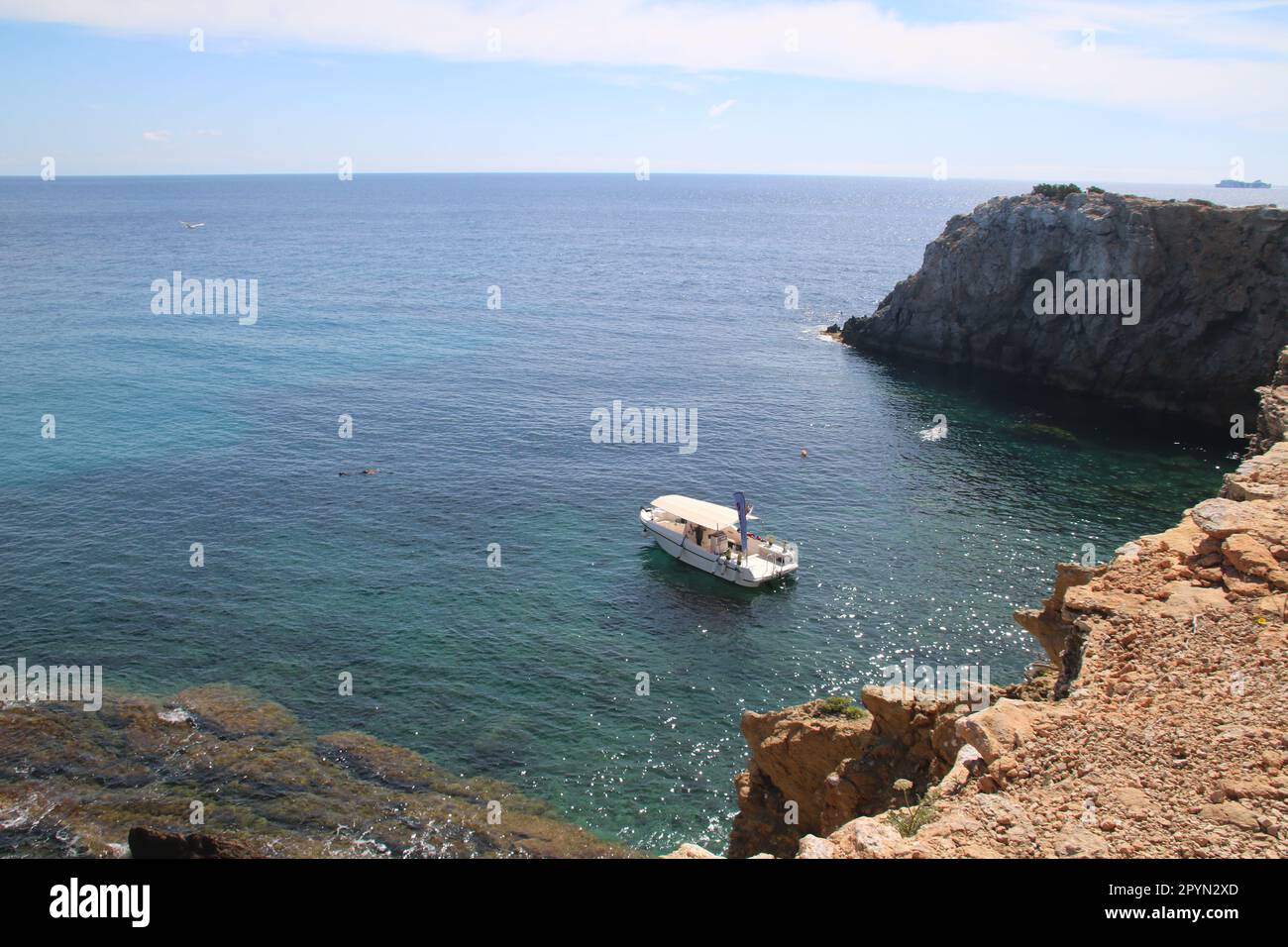 luxury boat moored in a quiet sea cove on Ibiza Stock Photo - Alamy