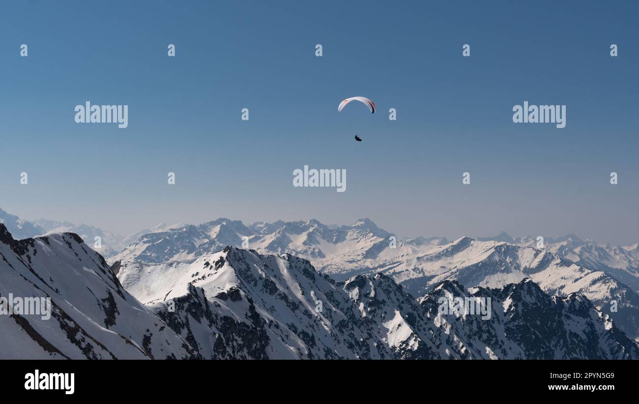 Flying over mountains in winter hi-res stock photography and images - Alamy