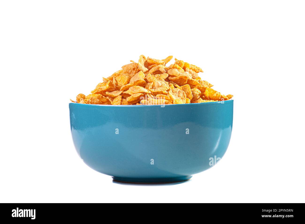 blue bowl with corn flakes against white background Stock Photo - Alamy