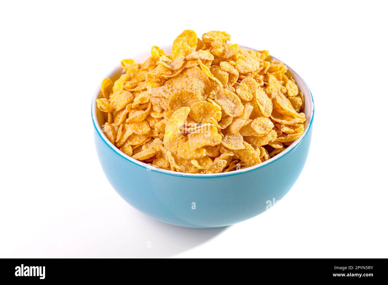blue bowl with corn flakes against white background Stock Photo - Alamy