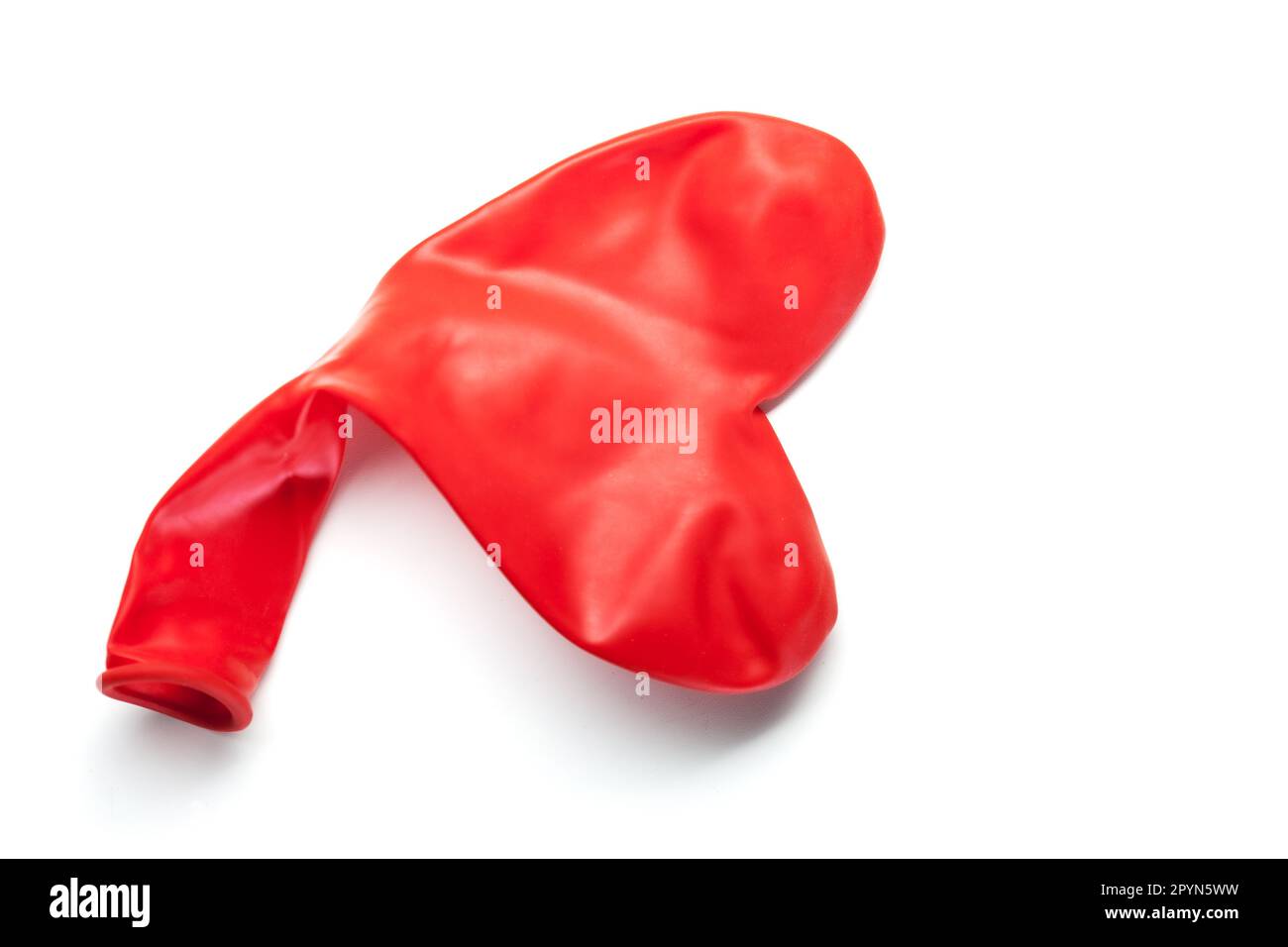 Deflated red heart shaped balloon isolated on white background Stock ...