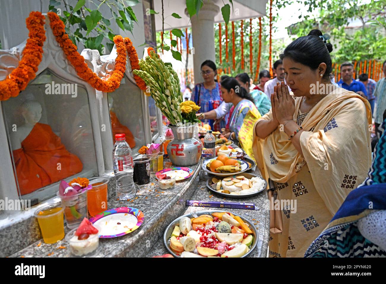 Dhaka, Bangladesh, on May 4, 2023, Buddhist devotee offers prayers at a ...