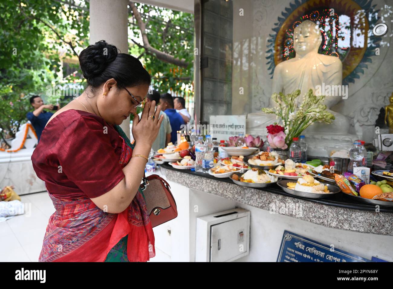 Buddhist devotee offers prayers at a temple during the Buddha Purnima ...