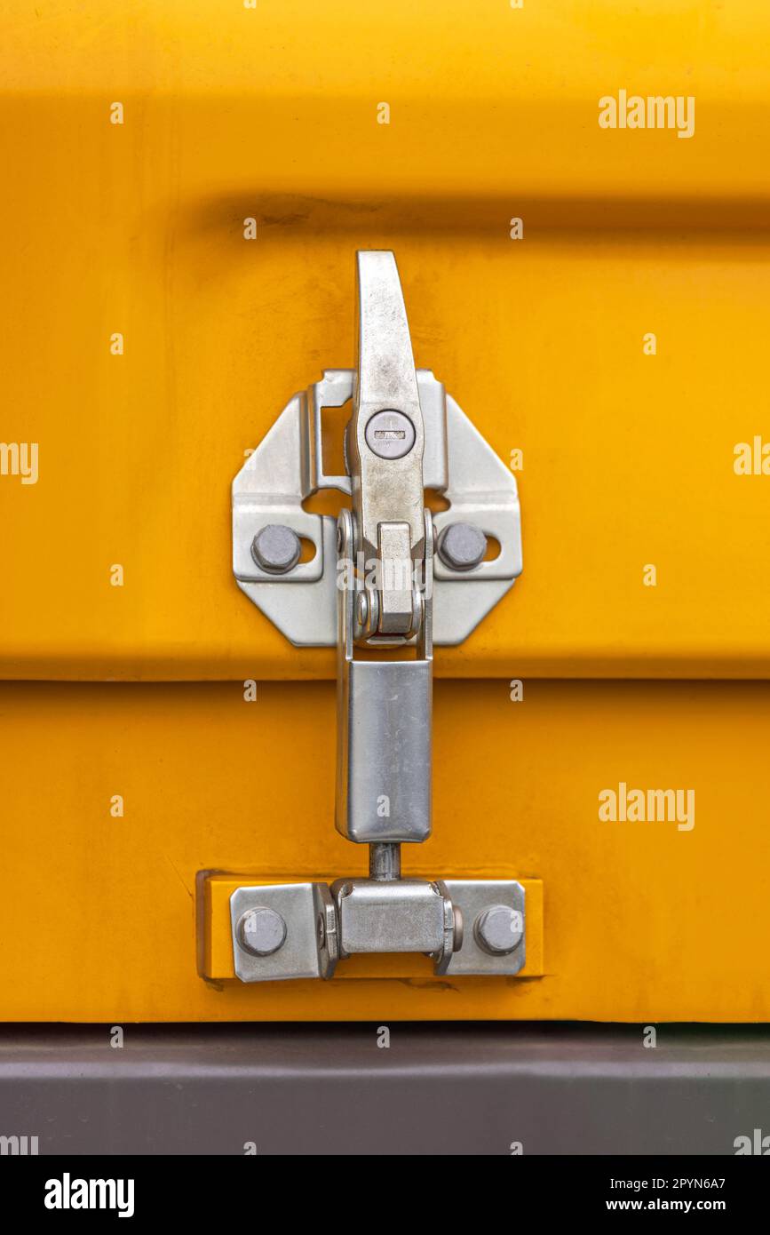 Latch With Lock at Yellow Construction Machine Vehicle Stock Photo - Alamy