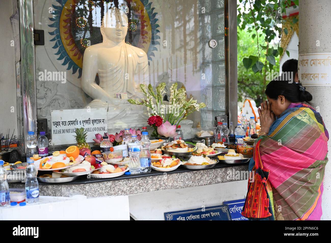 Buddhist devotee offers prayers at a temple during the Buddha Purnima ...