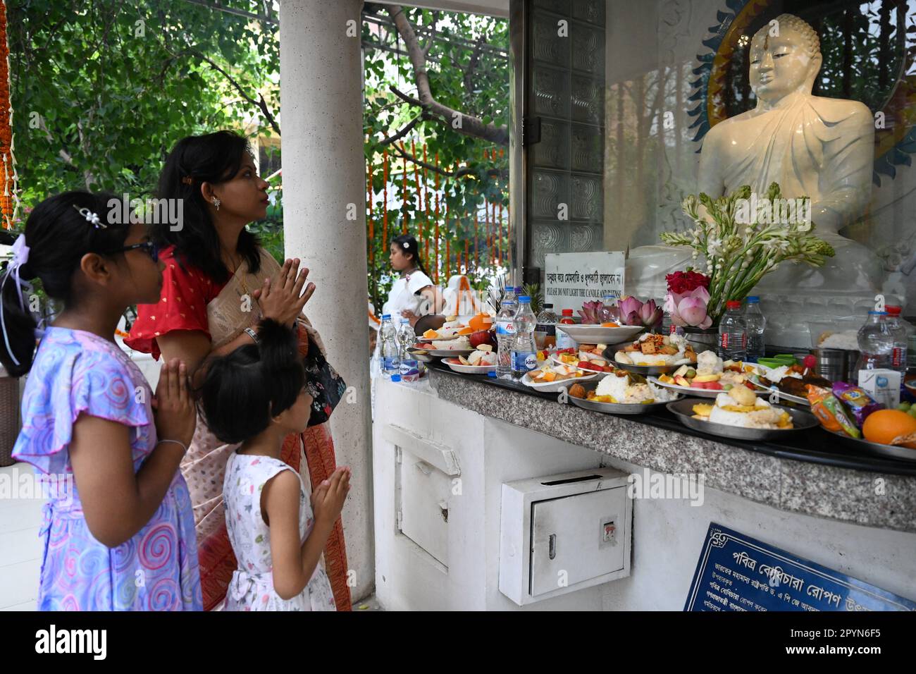 Buddhist devotee offers prayers at a temple during the Buddha Purnima ...