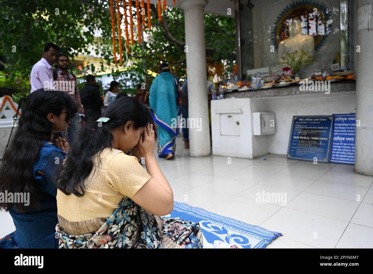 Buddhist devotee offers prayers at a temple during the Buddha Purnima ...
