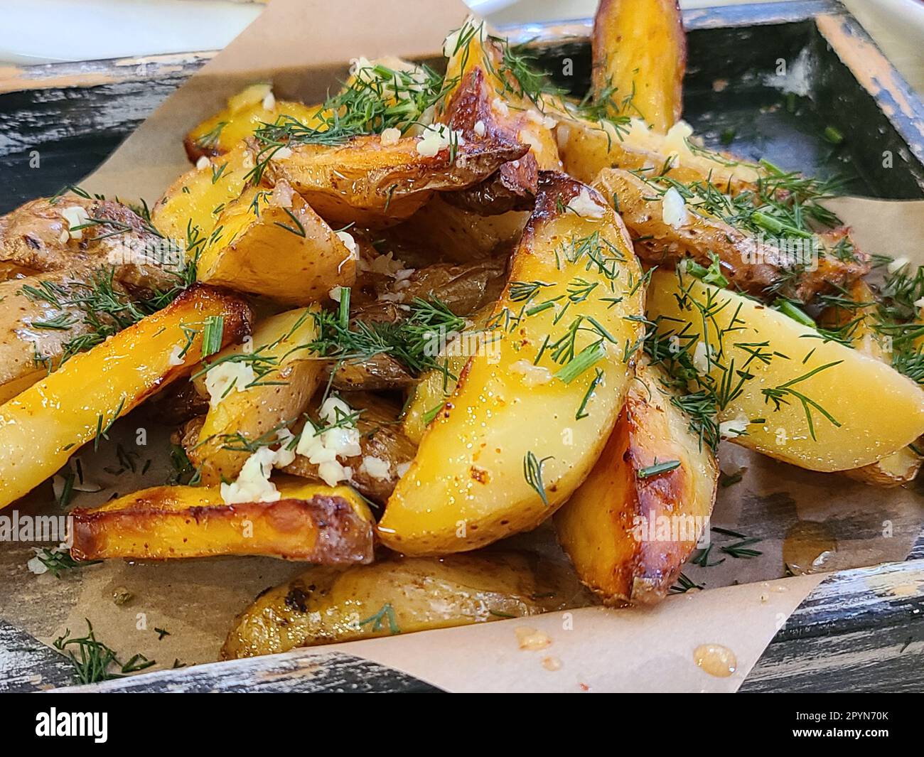 Rustic potato on wooden background Stock Photo - Alamy