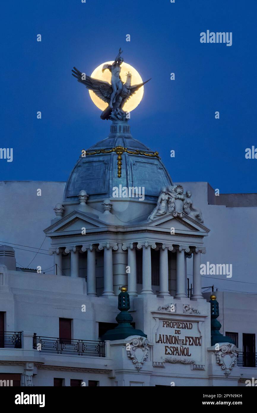 Moon behind La Union y el Fenix statue in Valencia Stock Photo - Alamy