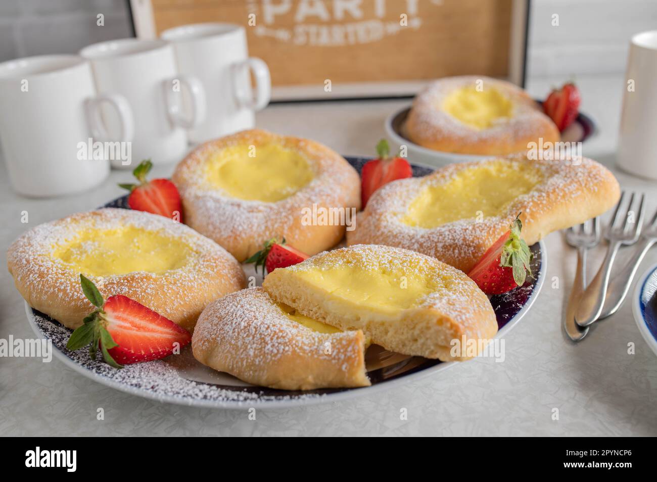 Yeast pastry with sour cream, pudding filling on a platter Stock Photo ...