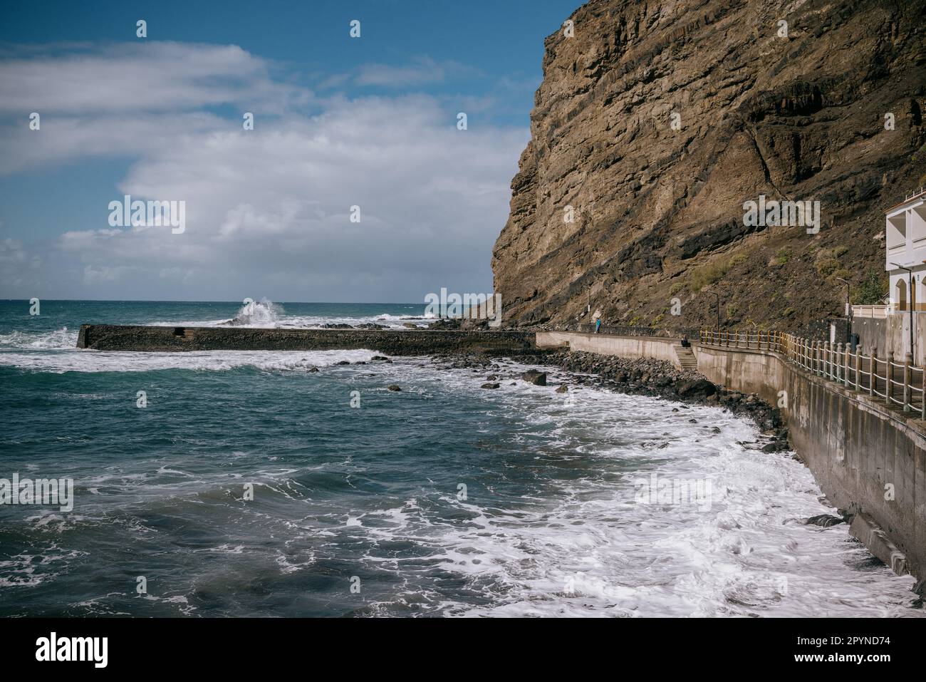 A picturesque beach landscape featuring a rocky shoreline La Gomera ...