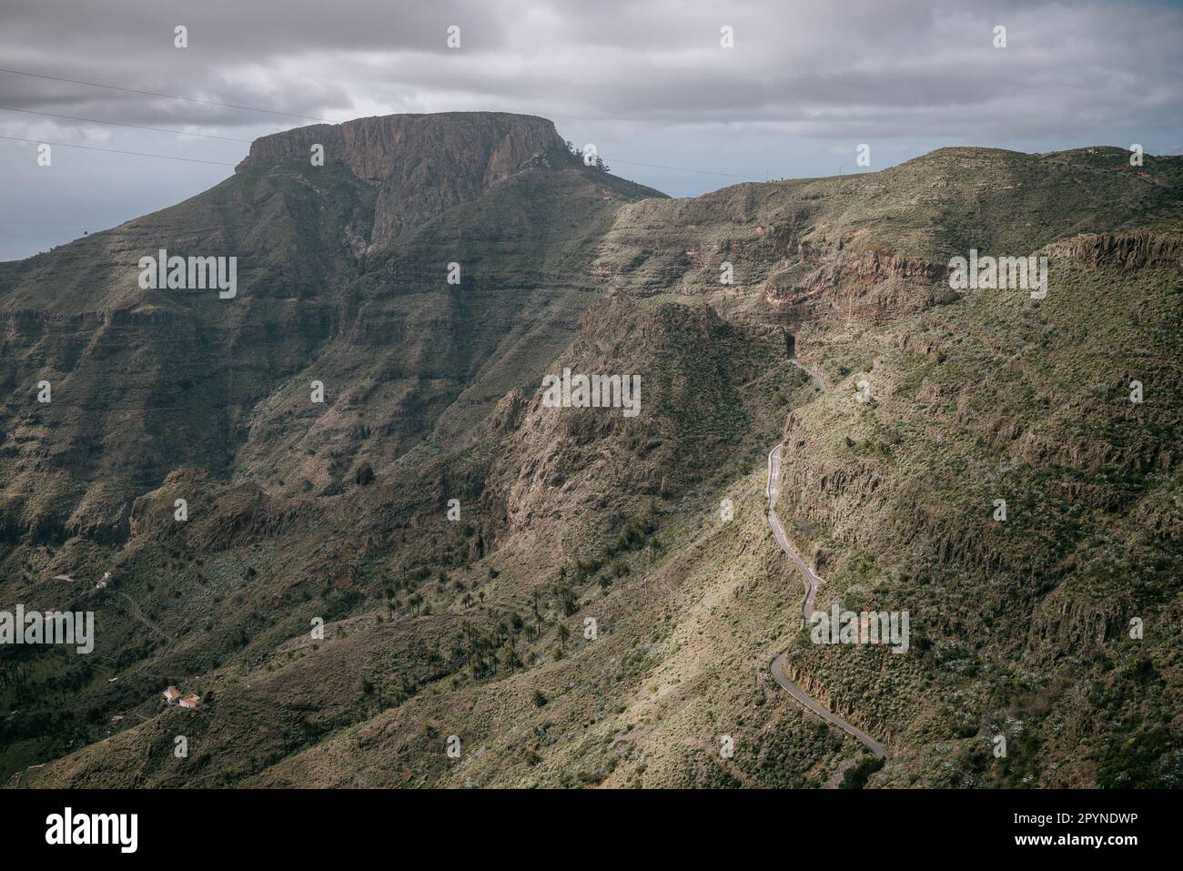 A scenic mountain trail with a stunning view of the surrounding ...