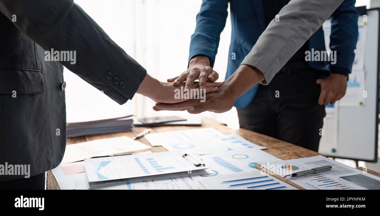 Business teamwork join hands together. group of young people putting ...