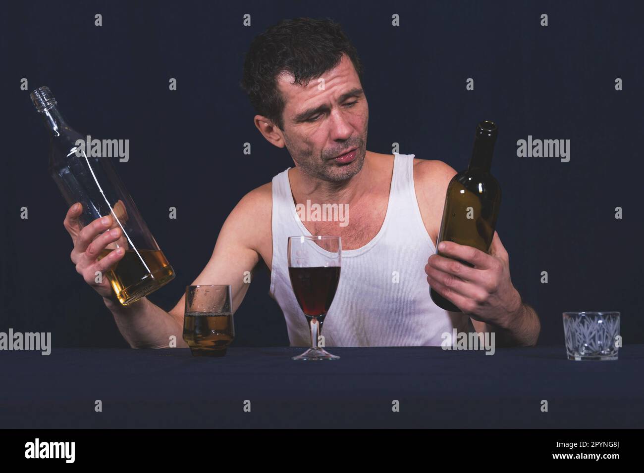 A drunk lonely man drinking alcohol Stock Photo - Alamy