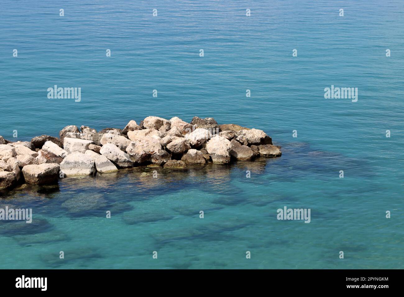 Rocks in the middle of a blue sea. Texture, wallpaper, background Stock ...