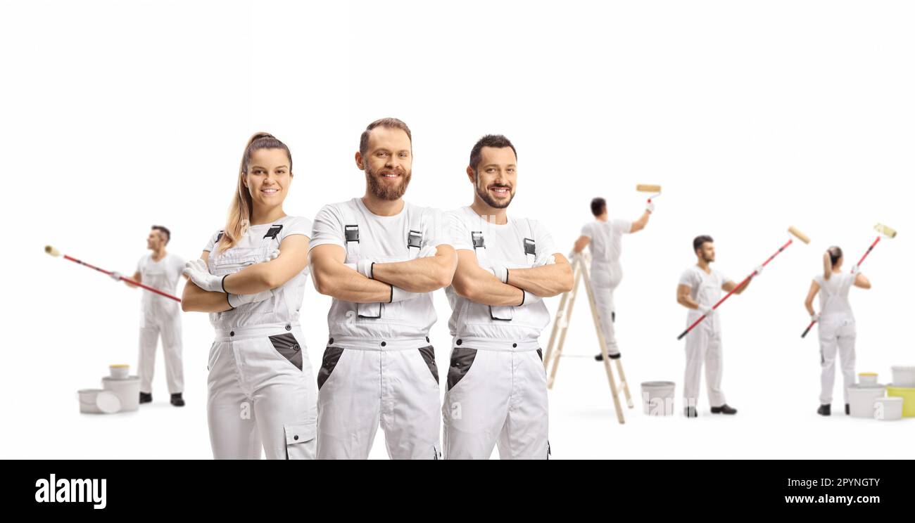 Team of professional painters decorating a wall isolated on white ...