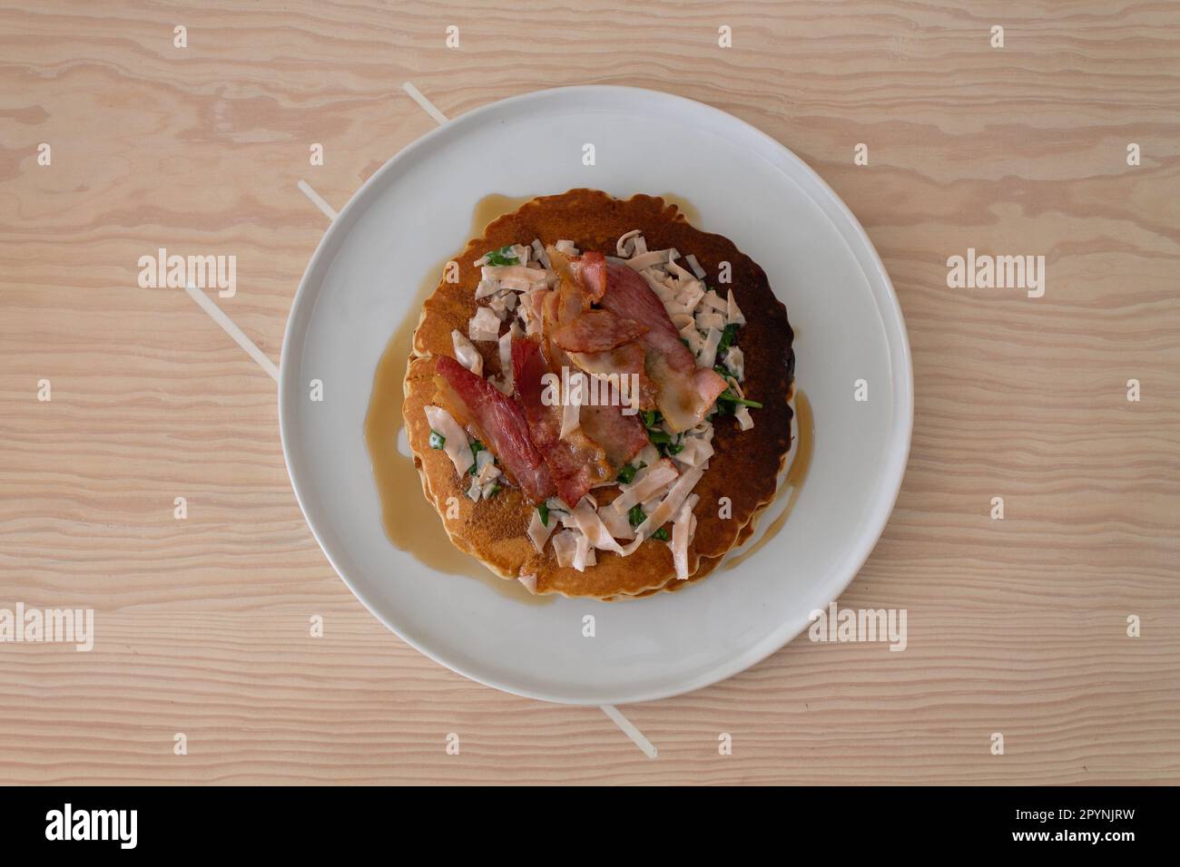 Tasty breakfast hot cakes with turkey ham, spinach and cream mix and ...