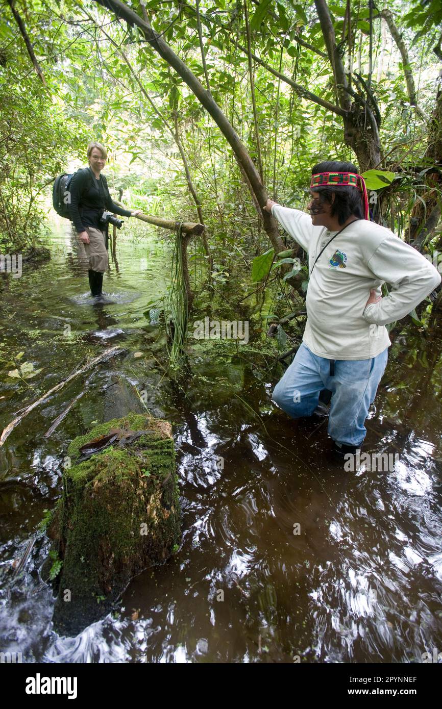 Oriente Region, Ecuador - April 1, 2006: Tourists treking through the ...