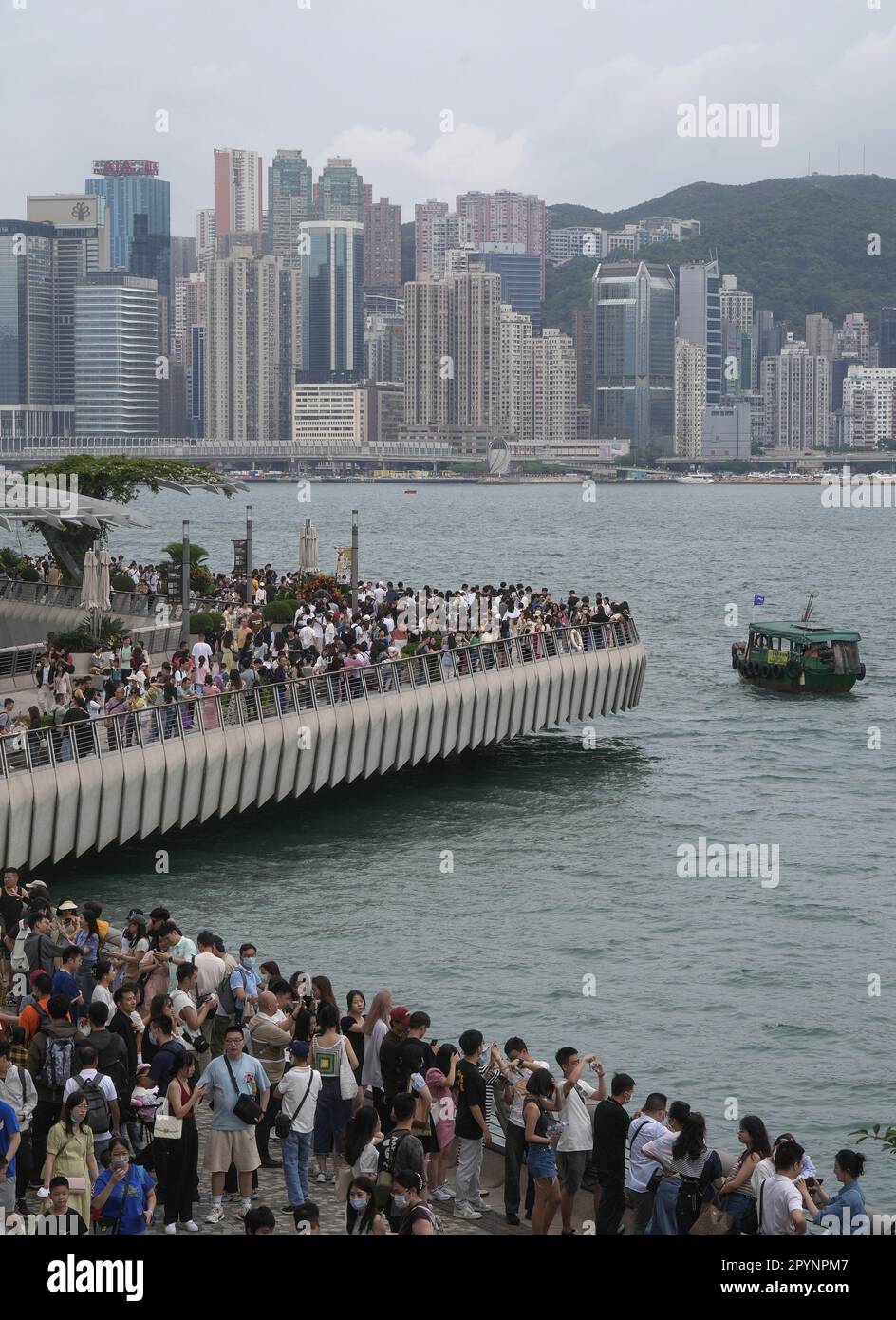 The waterfront of Tsim Sha Tsui is crowded with tourists on Labour Day ...