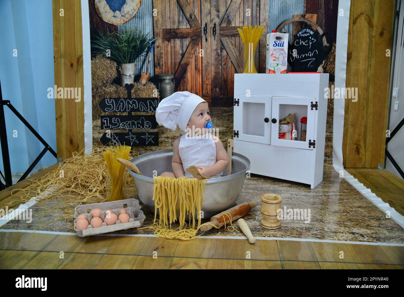 Baby cooking pasta Stock Photo - Alamy