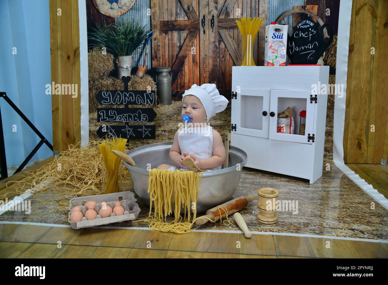 Baby cooking pasta Stock Photo - Alamy