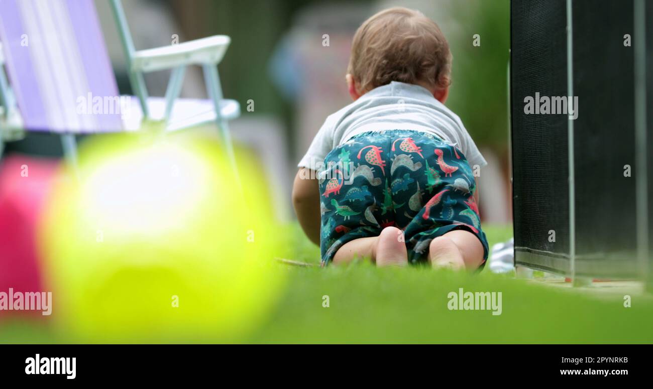 Toddler crawling outside yard hi-res stock photography and images - Alamy