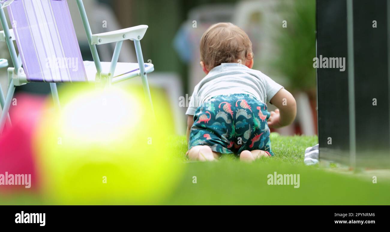 Toddler crawling outside yard hi-res stock photography and images - Alamy