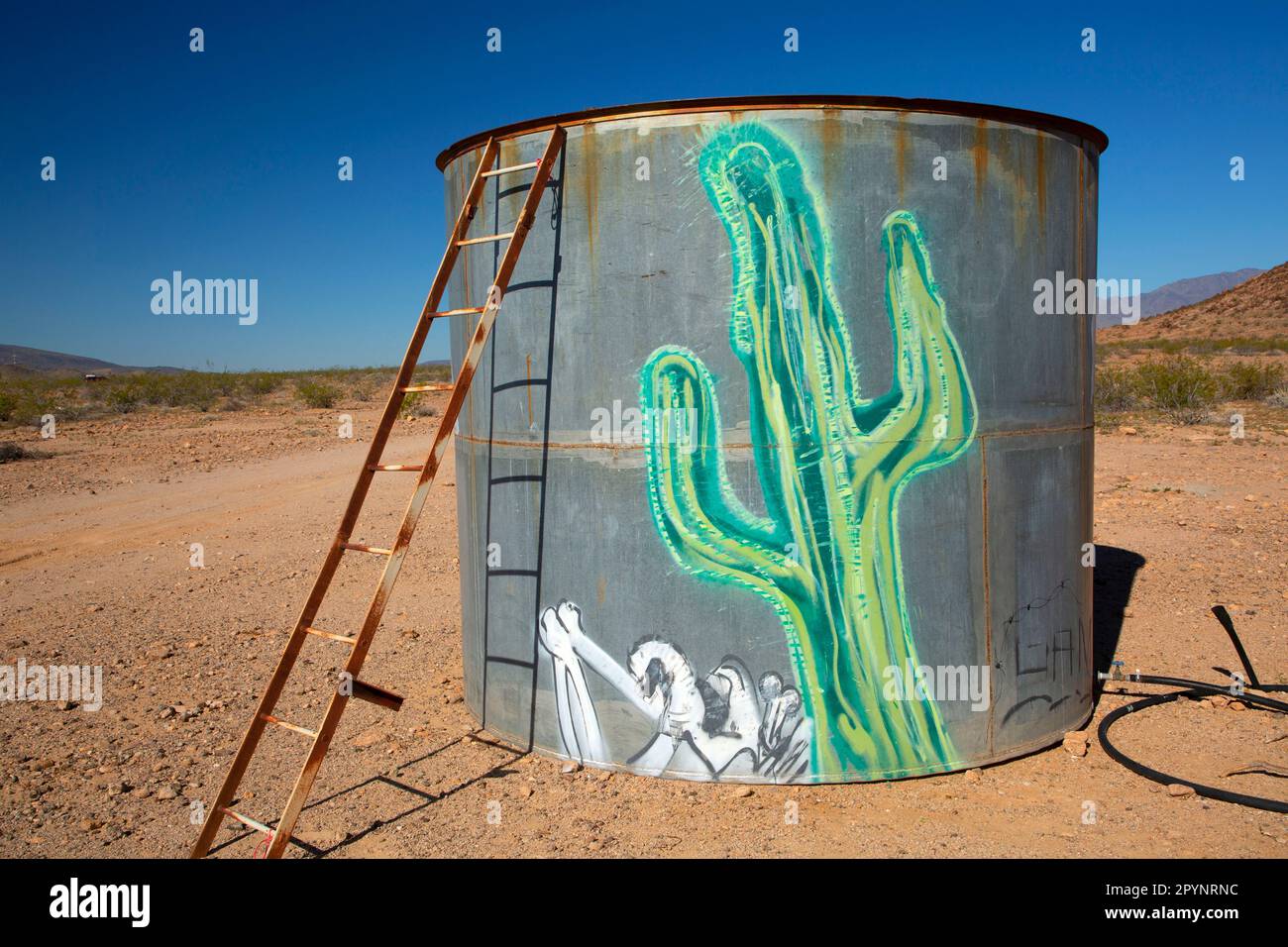 Painted water tank at Blind Hills, Mojave National Preserve, California ...
