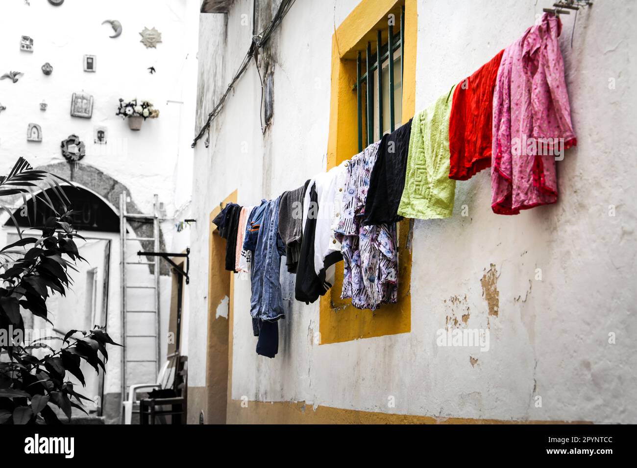 Typical Portuguese window with hanging clothes in Evora town Stock ...