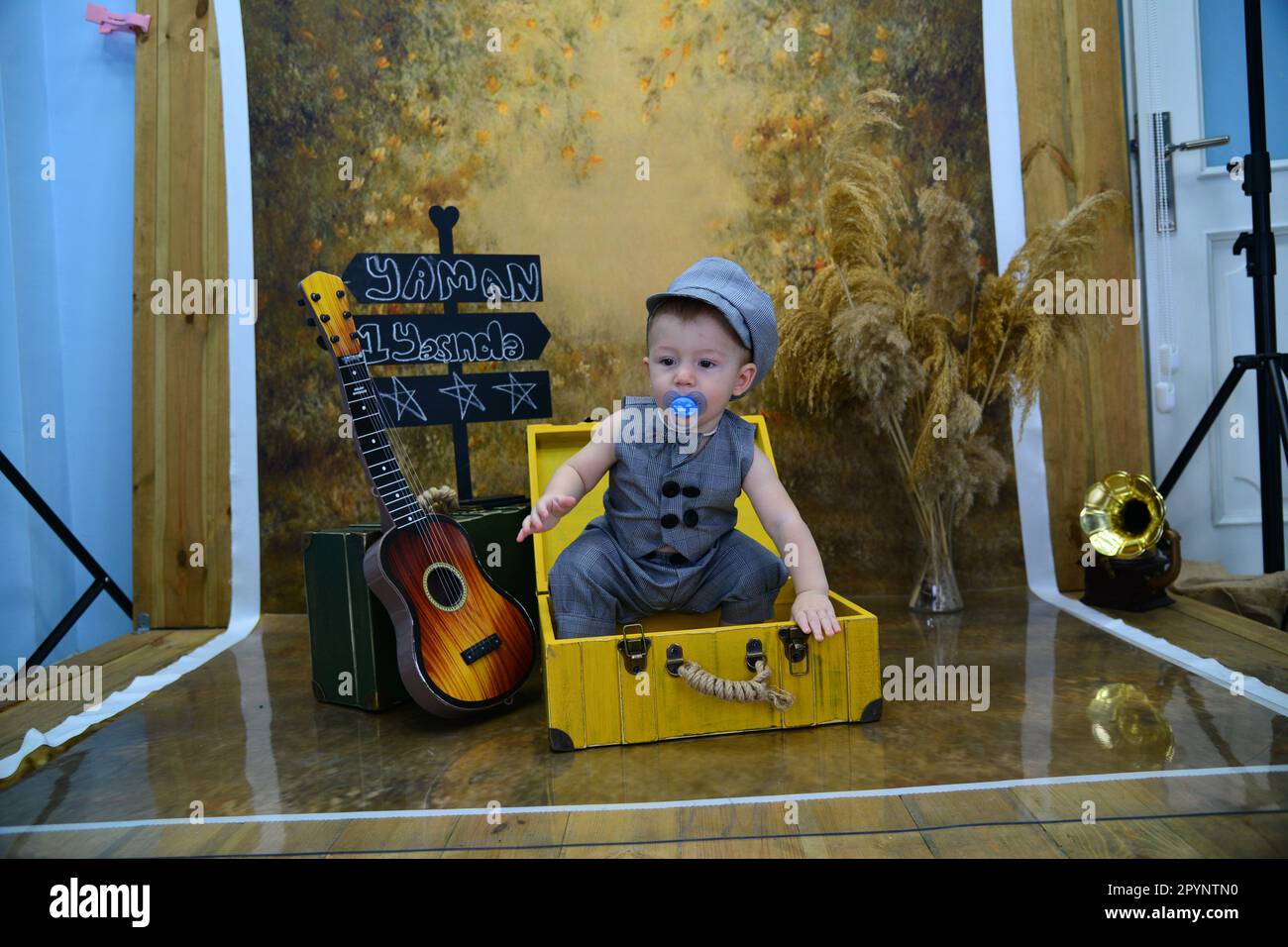 Musician baby playing guitar Stock Photo - Alamy