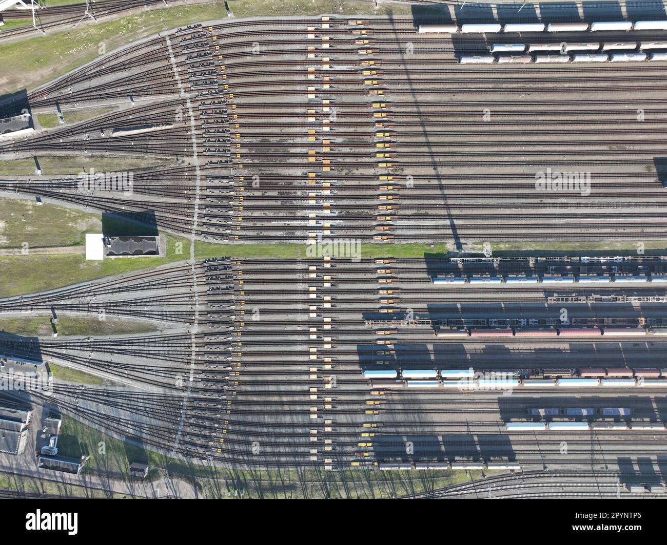 Aerial drone video showcasing the inner workings of a bustling railway ...