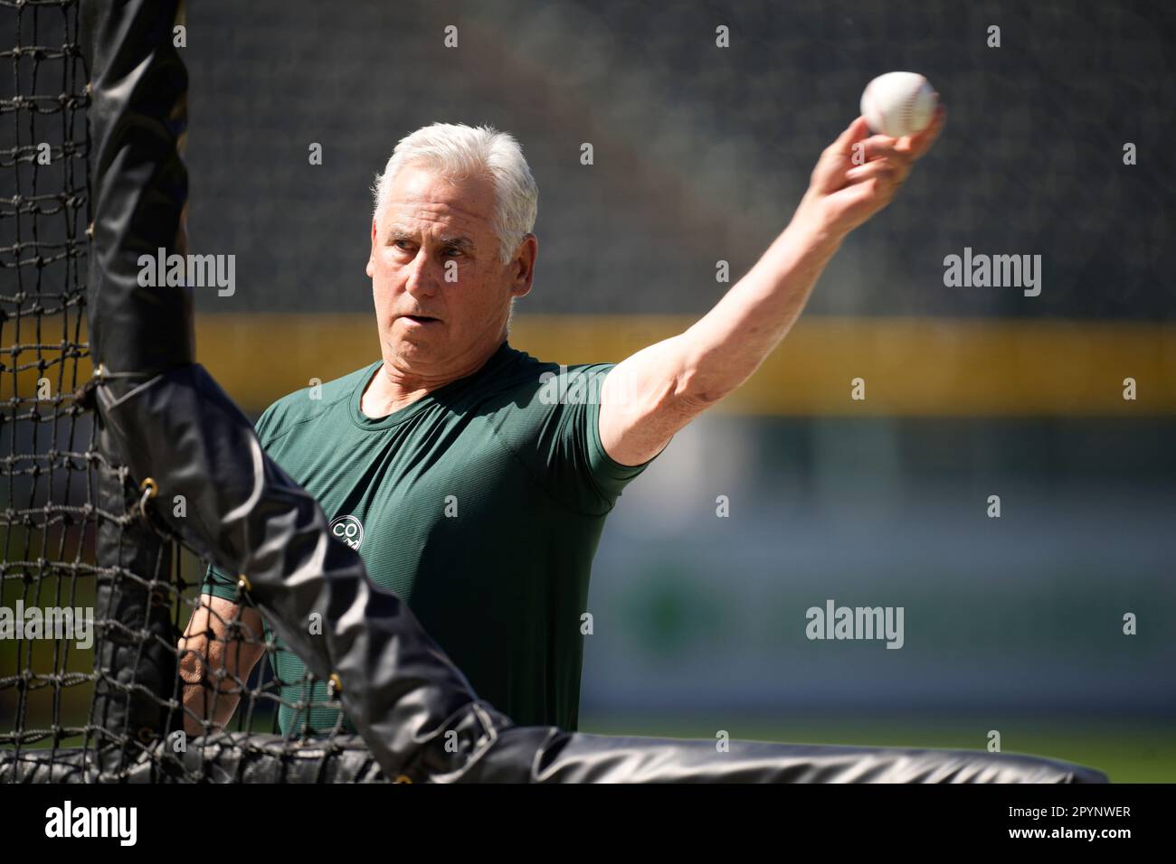 Colorado Rockies manager Bud Black (10) throws batting practice before ...