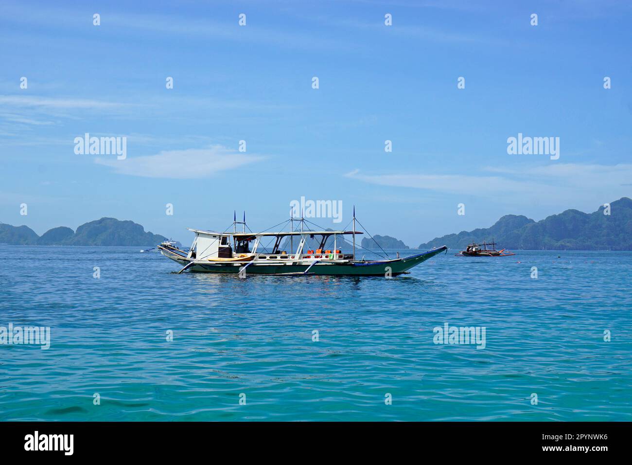 wooden traditional outrigger boats on palawan island at the philippines ...